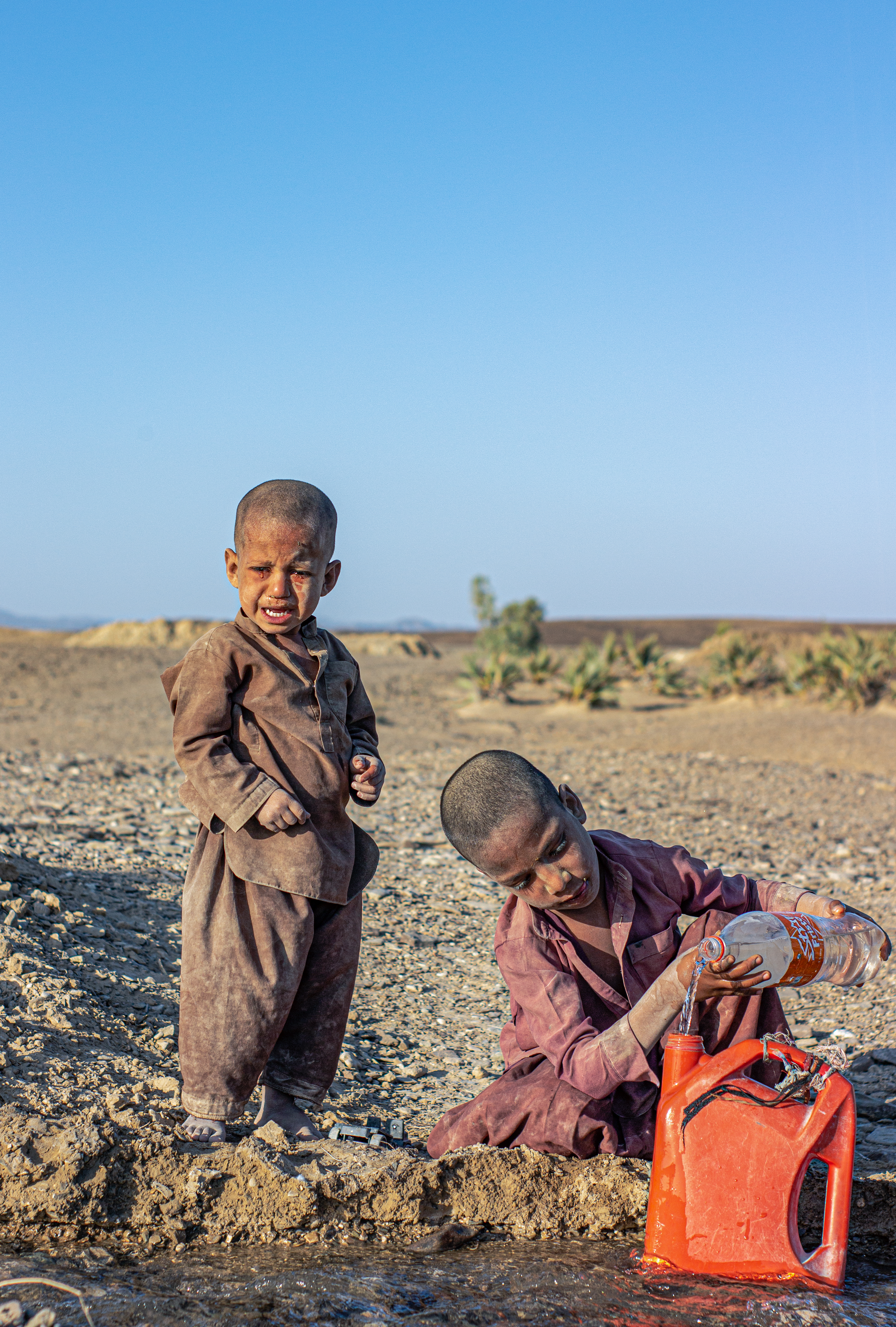Drought affected Children Collecting water | Foundation